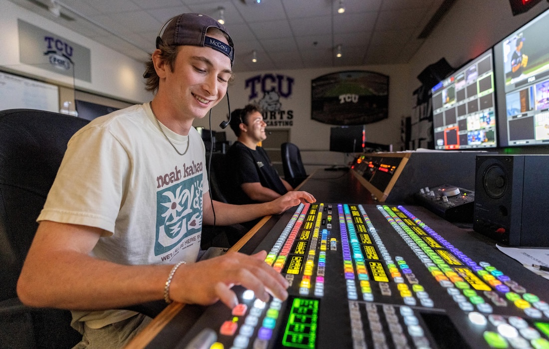 A person uses a switchboard to edit video clips